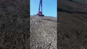 Планировка колёсным экскаватором планировочной стрелой 15 метров