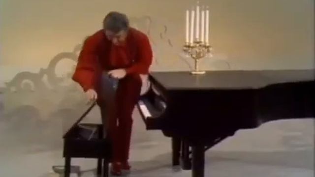 Have fun with Liberace_ Lee has to do some _work_ with his piano (1971)