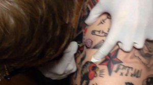 Zach Tattoos Tomo at Mustang Tattoo