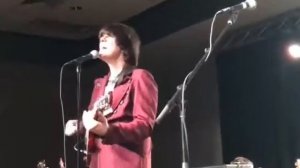 Cathy ties Liverpool Legend, John Lennon’s, shoe during a performance