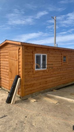 Мобильная брусовая баня 6x2,3м. с двухскатной крышей комплектация "Стандарт"