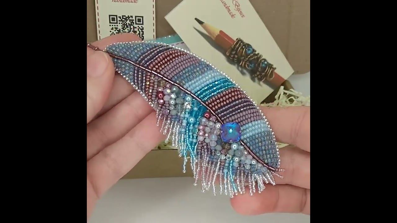Feather embroidered brooch