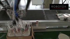 Упаковка молока в короб роботом ROBOTOX_D4A-1130-3
