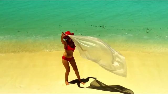 Maldives, Sun Island,  a girl on the beach, honeymoon, shooting from a quadrocopter.  1/4