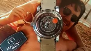 Часы Magnus унисекс с автоподзаводом с 21 камнями, серо-голубой циферблат, видно механизм. Цена 167