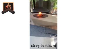 Эксклюзивный подвесной камин AVES в отделке из массива натурального камня, установленный Строй-Камин