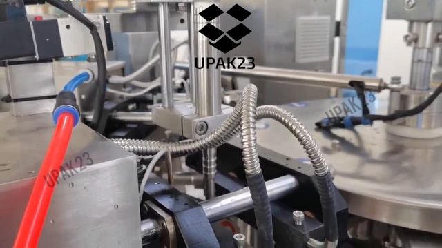 Роторная машина розлива жидких продуктов и запайки готовых пакетов дой пак со штуцером