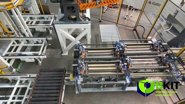 Линия депаллетизации с  роботом-разгрузчиком жестяных крышек