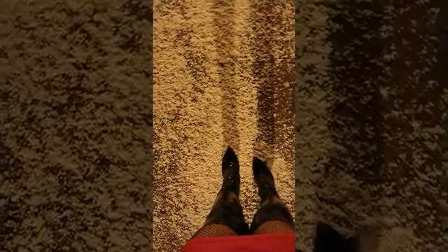 Walking at night with knee-high boots