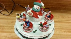 Hawthorne village Snowman spinning cups ride